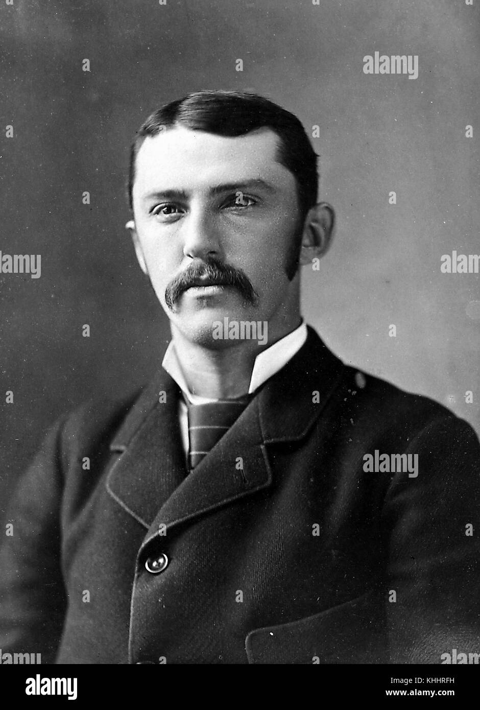 A photographic portrait of Steve Libby wearing a suit, he played one ...