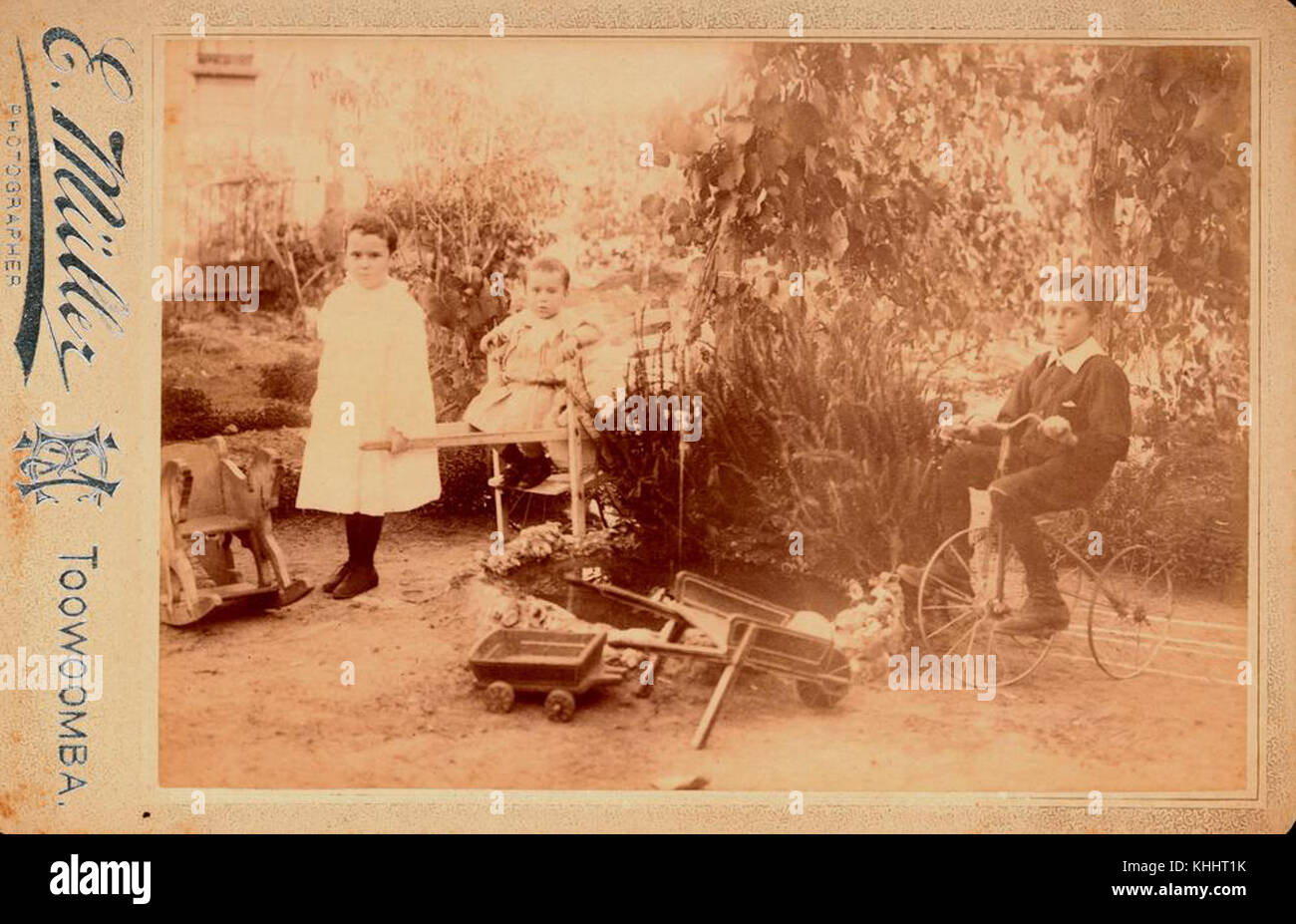 2 201815 Three children playing with their toys in the backyard, 1890 ...