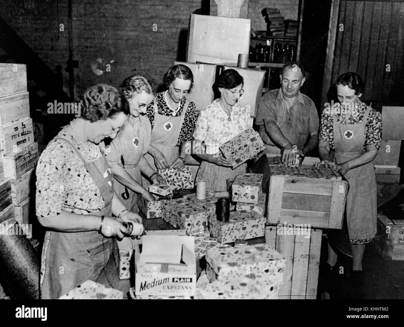 A photograph from October 1942 showing Red Cross workers packing ...