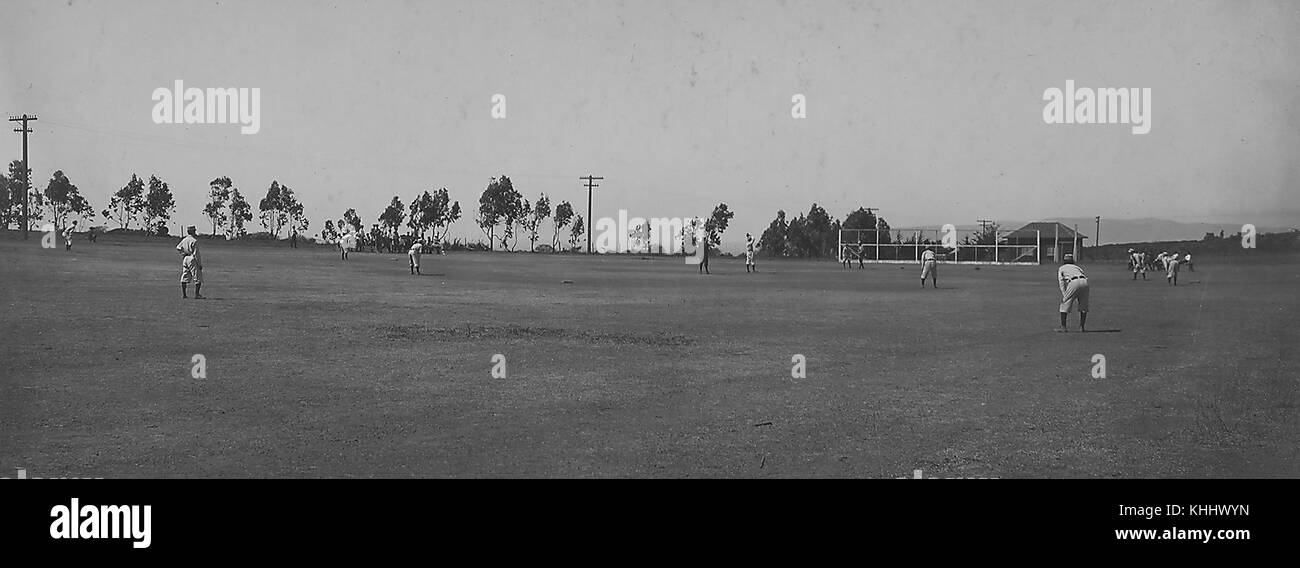 Photograph titled Eighteen players (nine on a side) with a ball and bat ...