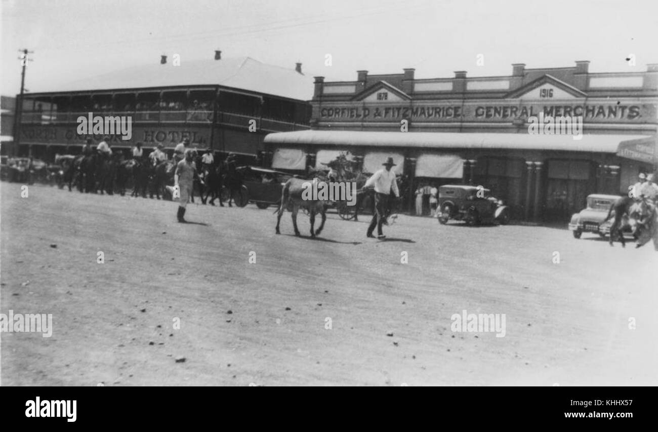 This photograph captures a rodeo procession in front of the North ...