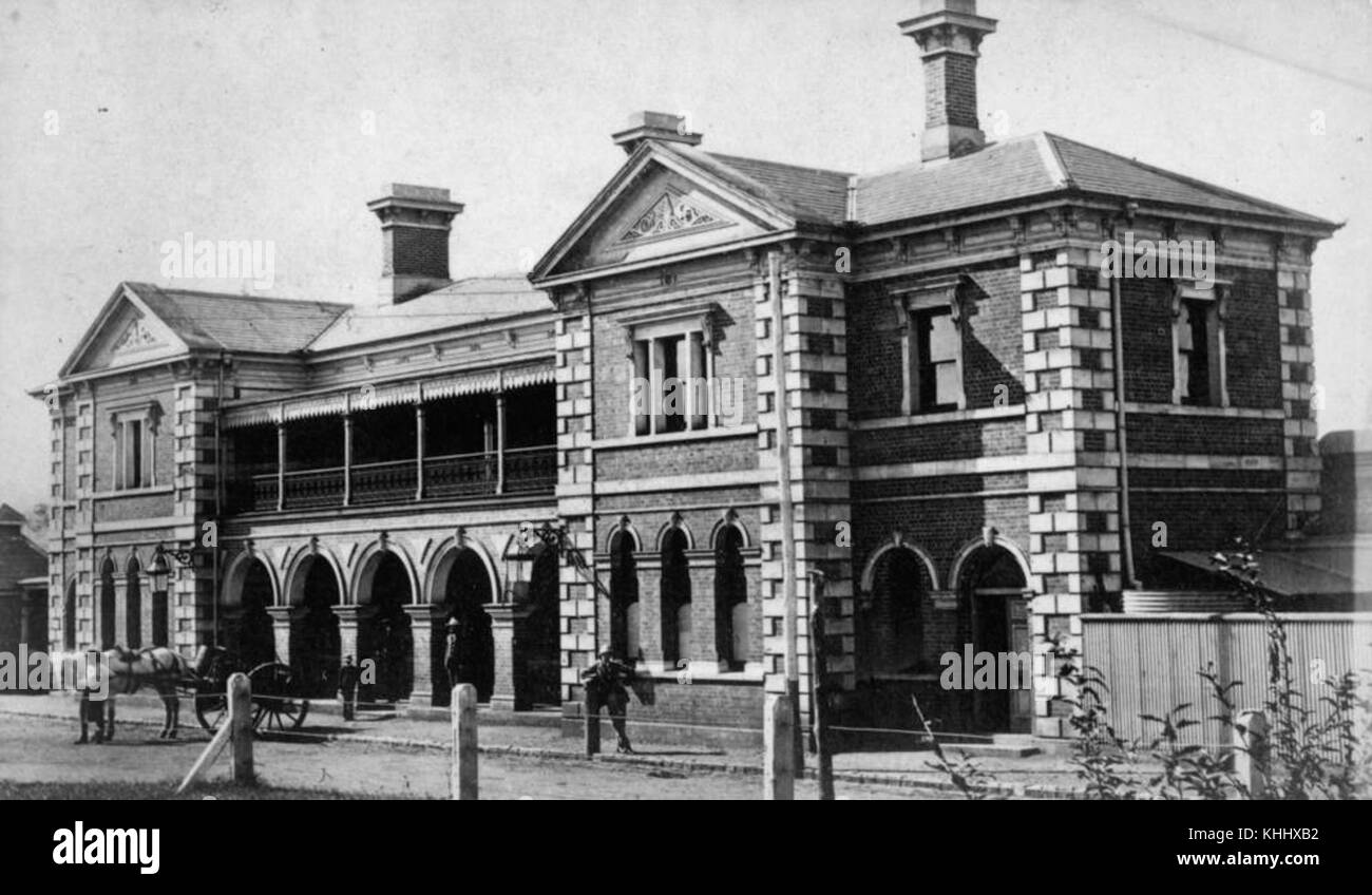 This historical photograph shows the two-storey railway station ...