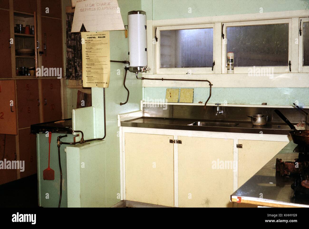 A photograph of a kitchen in a hostel, the counters and sink are shown ...