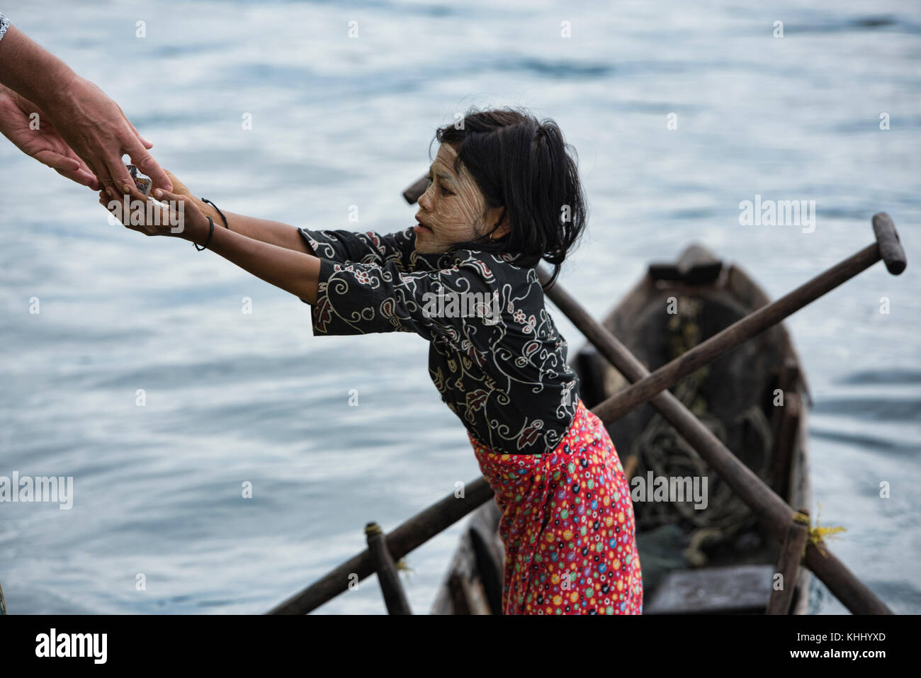 Moken girl receiving food in the Mergui Archipelago, Myanmar Stock ...