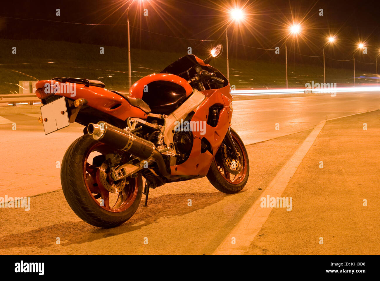 Sports motorcycle on the night road Stock Photo - Alamy