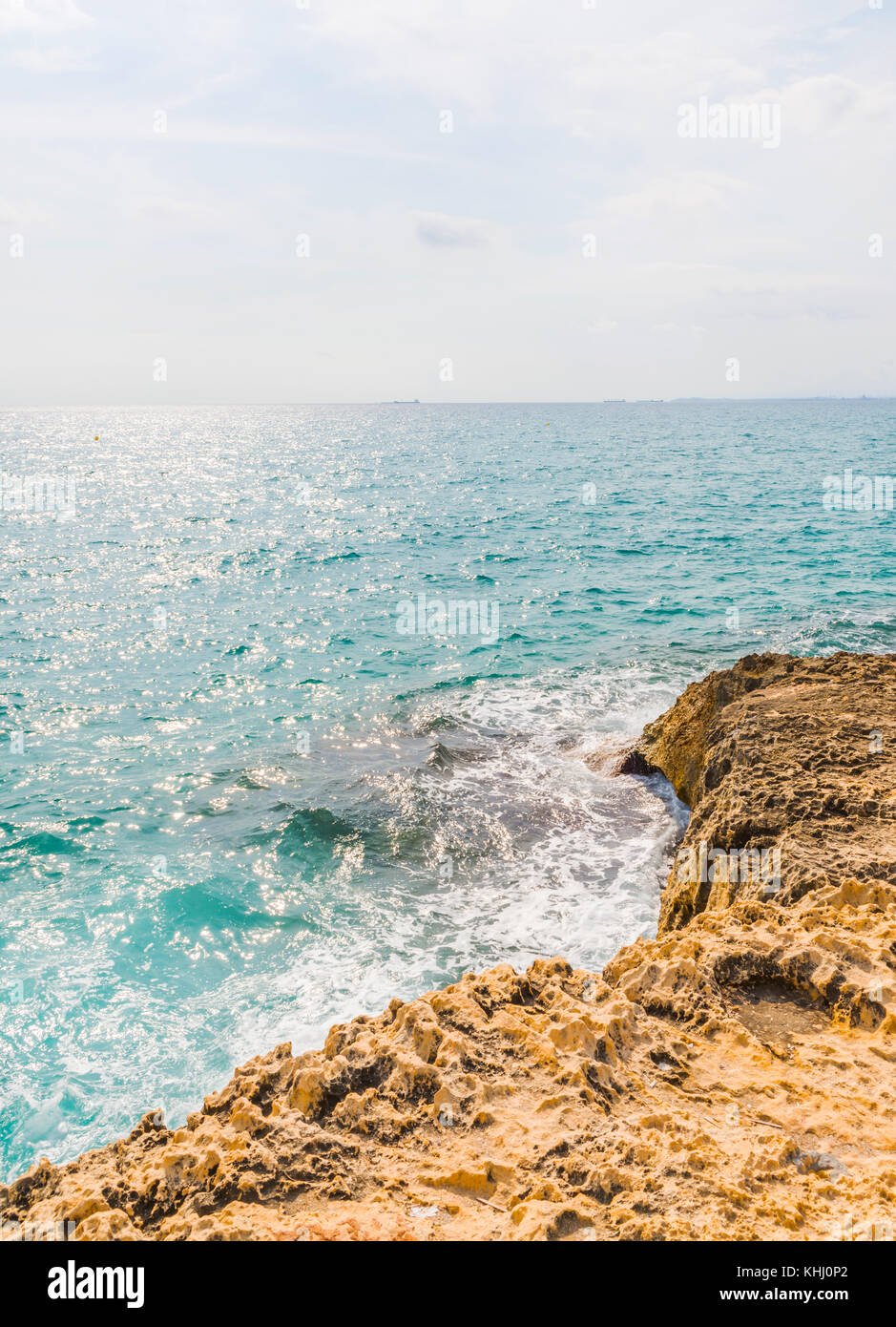 high cliff above the sea, summer sea background, many splashing waves ...