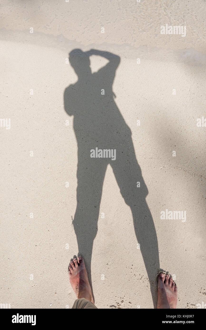 shadow of a photographer on the sand of a tropical beach Stock Photo ...