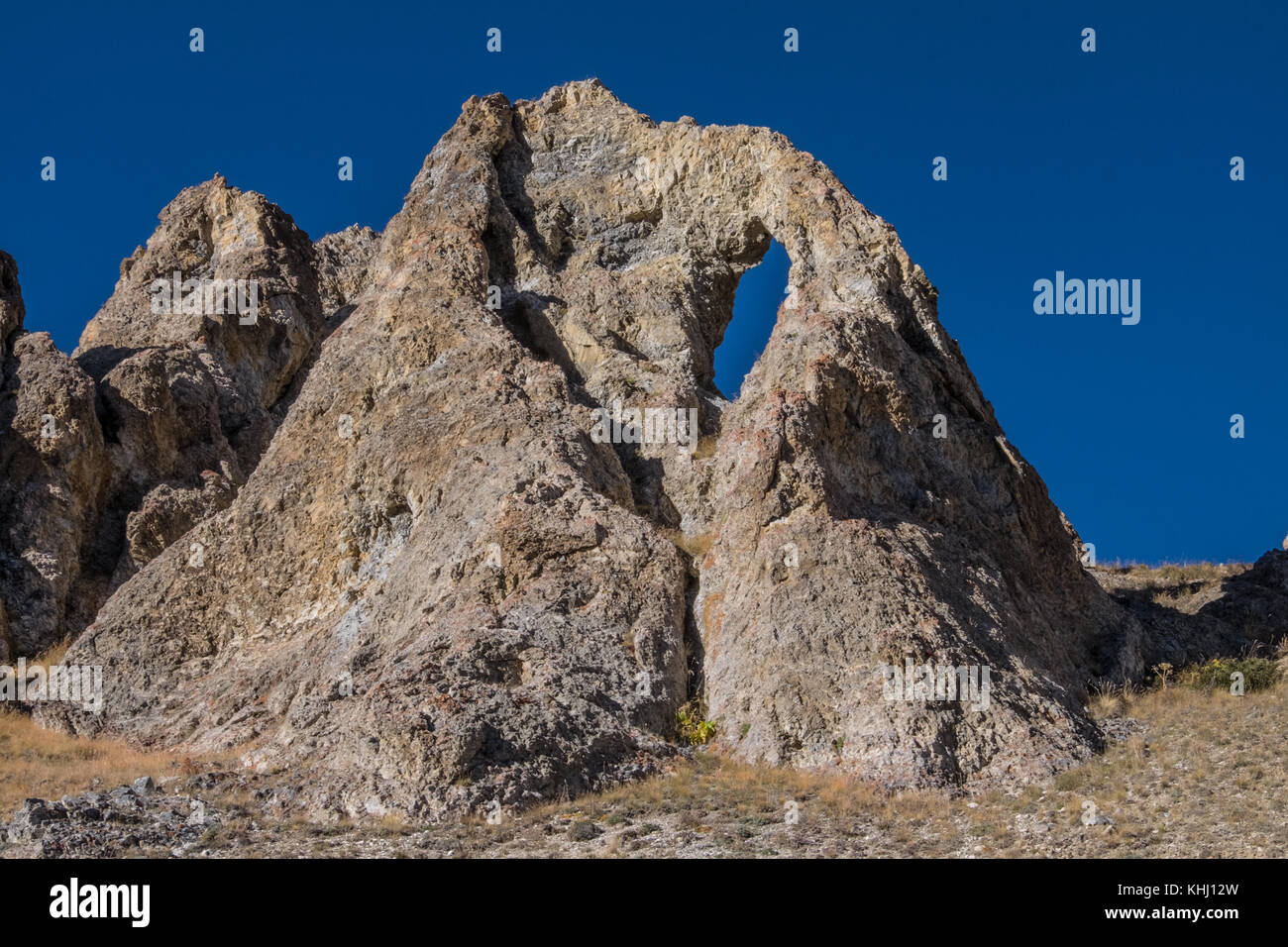 Natural holes limestone rock in the mountains Stock Photo - Alamy