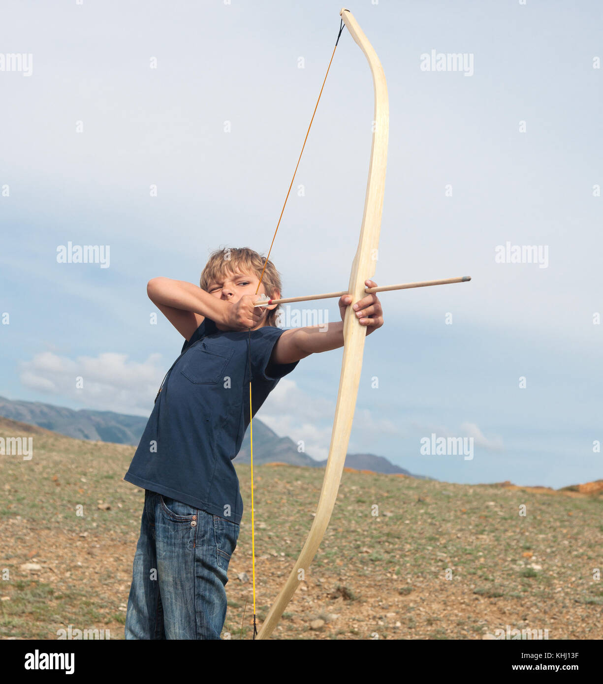 Boy shoots a bow at a target, in the open air Stock Photo - Alamy