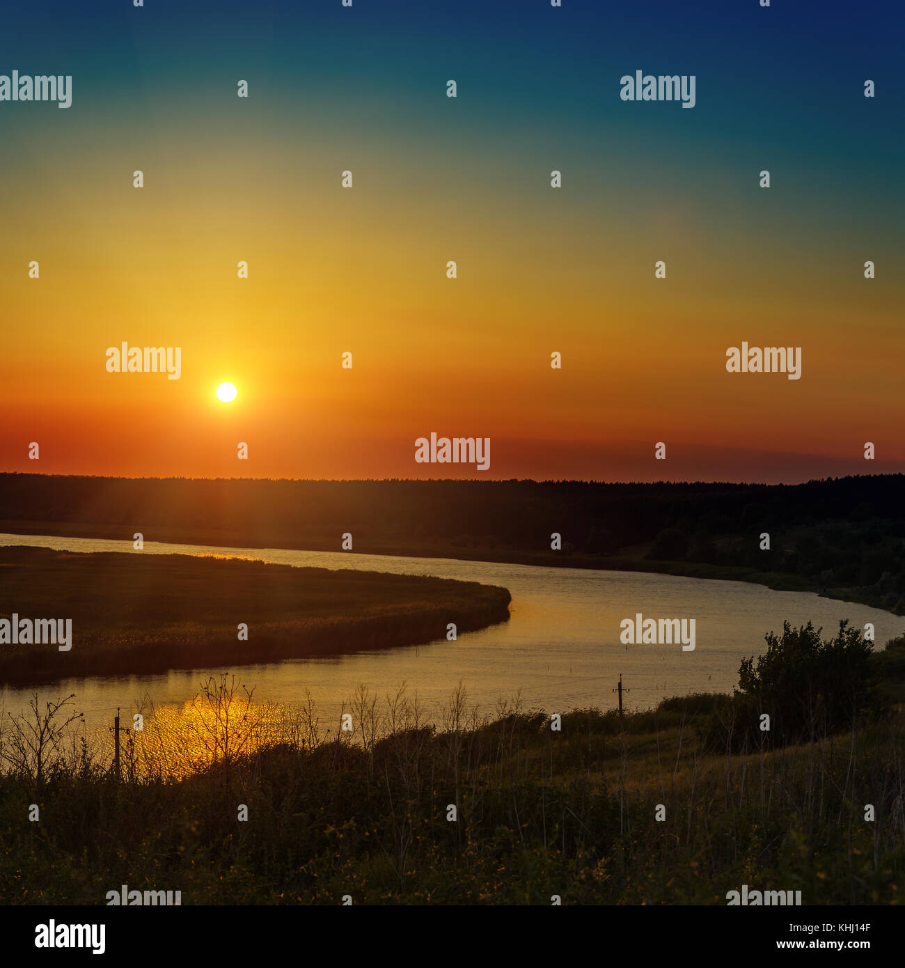 sunset over river Stock Photo - Alamy
