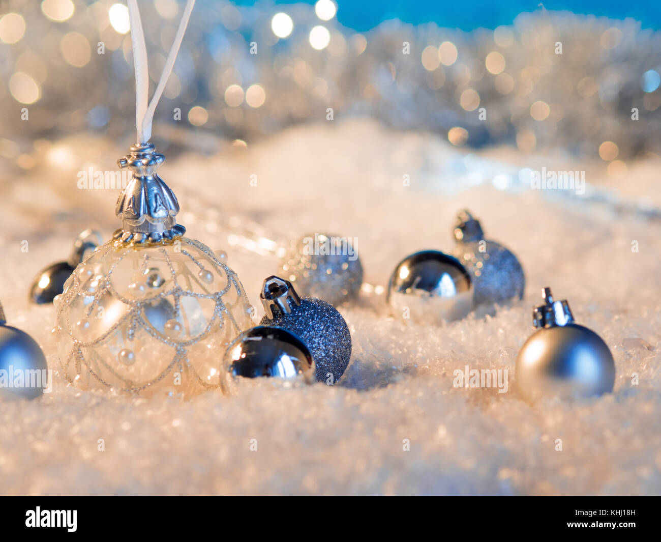 Christmas ball on the snow festive background Stock Photo - Alamy