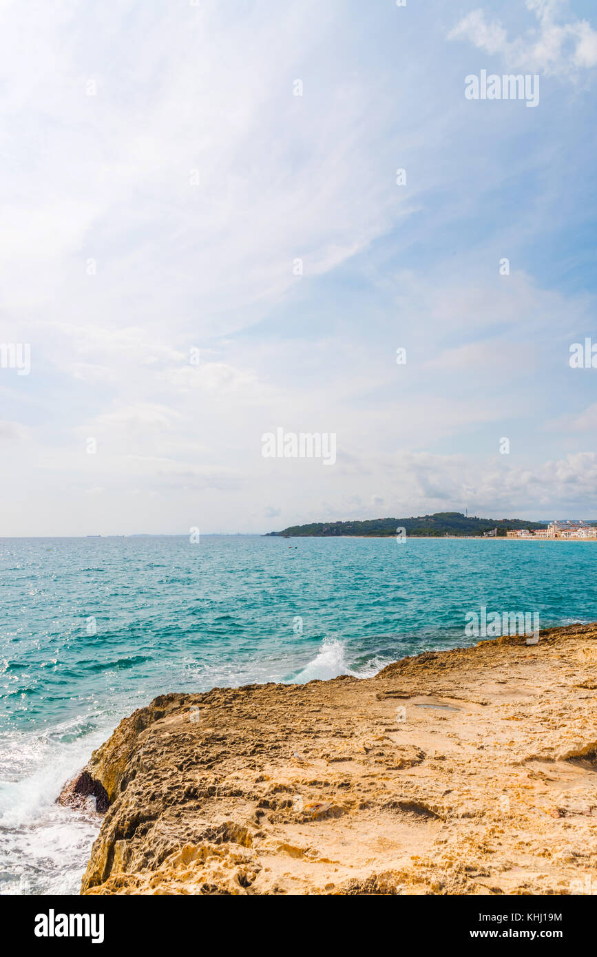 high cliff above the sea, summer sea background, many splashing waves ...