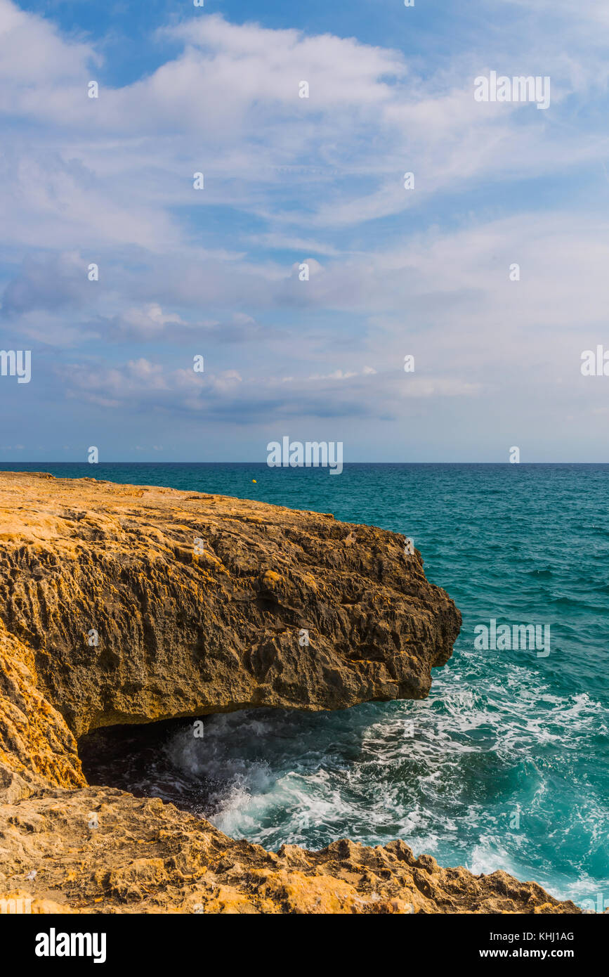 high cliff above the sea, summer sea background, many splashing waves ...