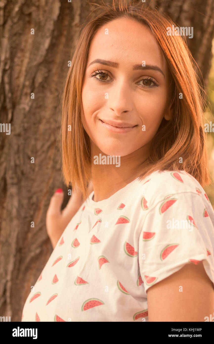 one young woman portrait head face, upper body, head and shoulders shot ...