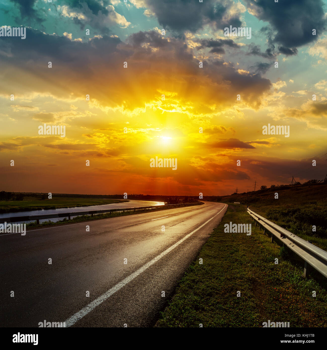 dramatic sunset over asphalt road Stock Photo - Alamy