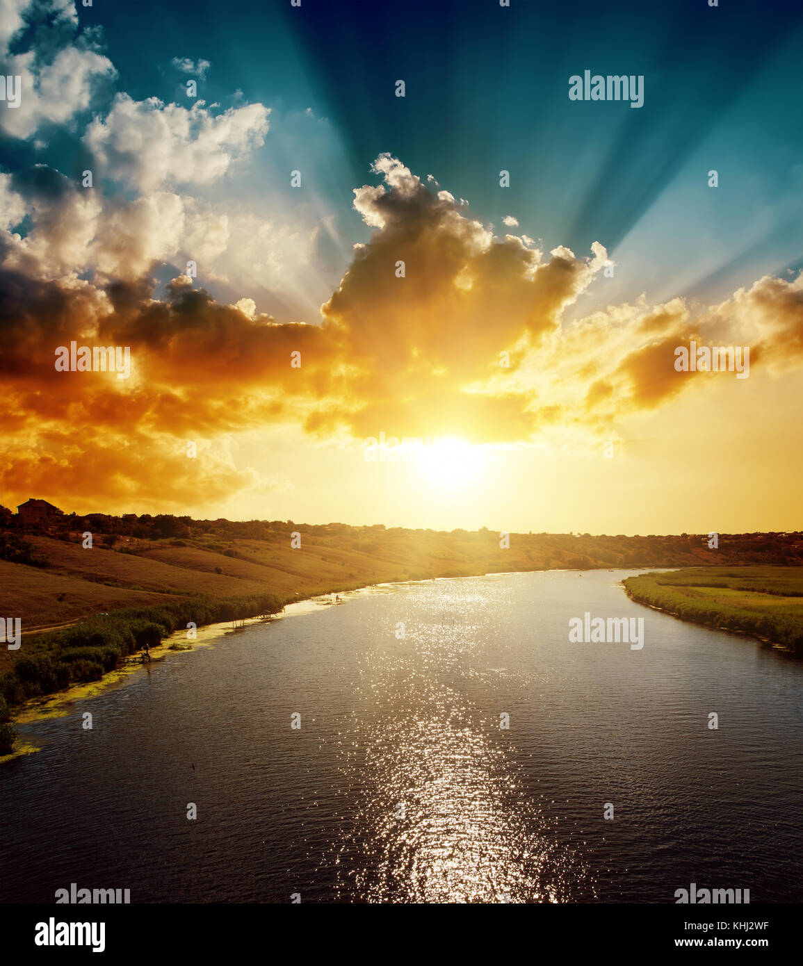 cloudy sunset over river Stock Photo - Alamy