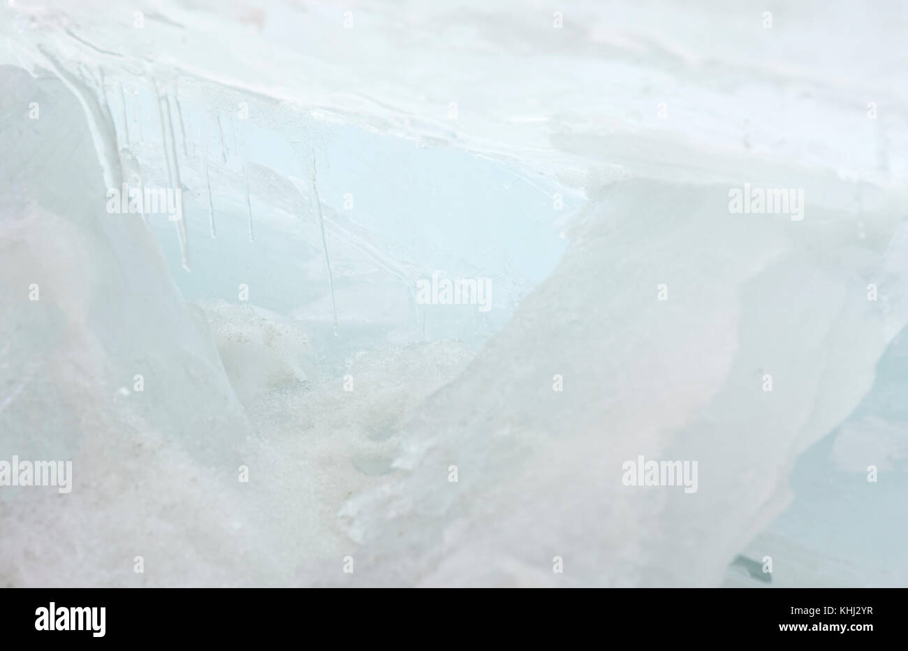 Transparent blue ice hummocks on lake Baikal shore. Siberia winter blur ...