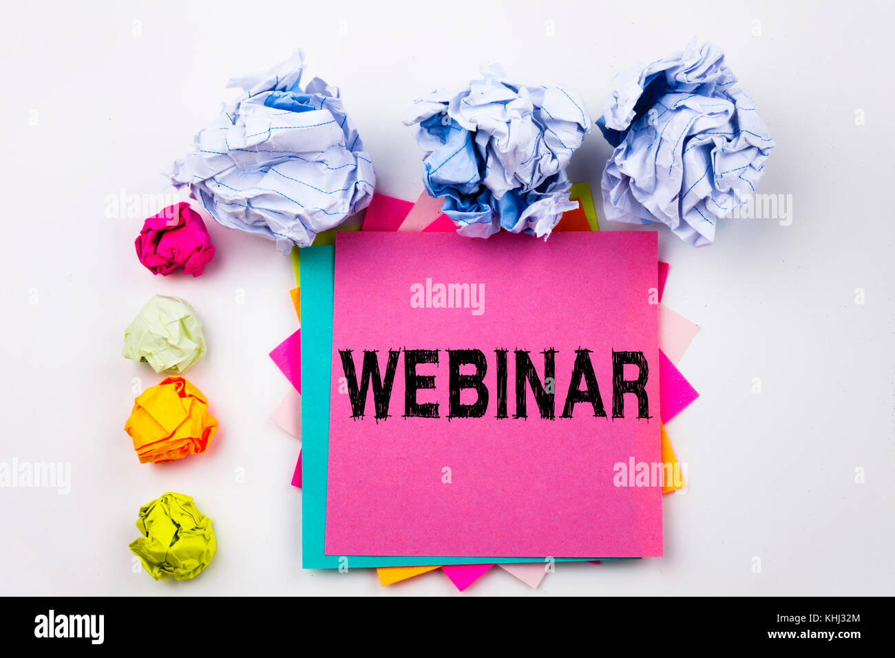 Writing text showing Webinar written on sticky note in office with ...