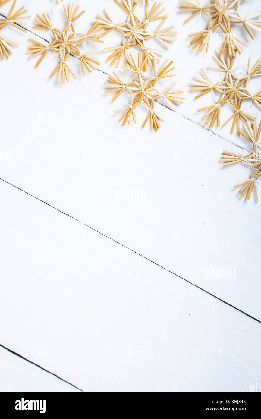 Christmas decor. Brown snowflakes on a white wooden background Stock ...