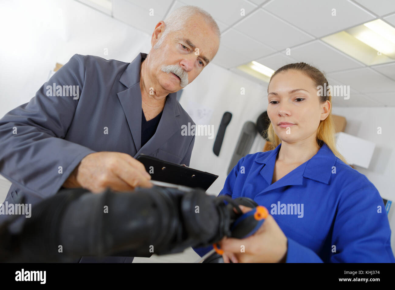 female training apprentice plumber with teacher Stock Photo - Alamy