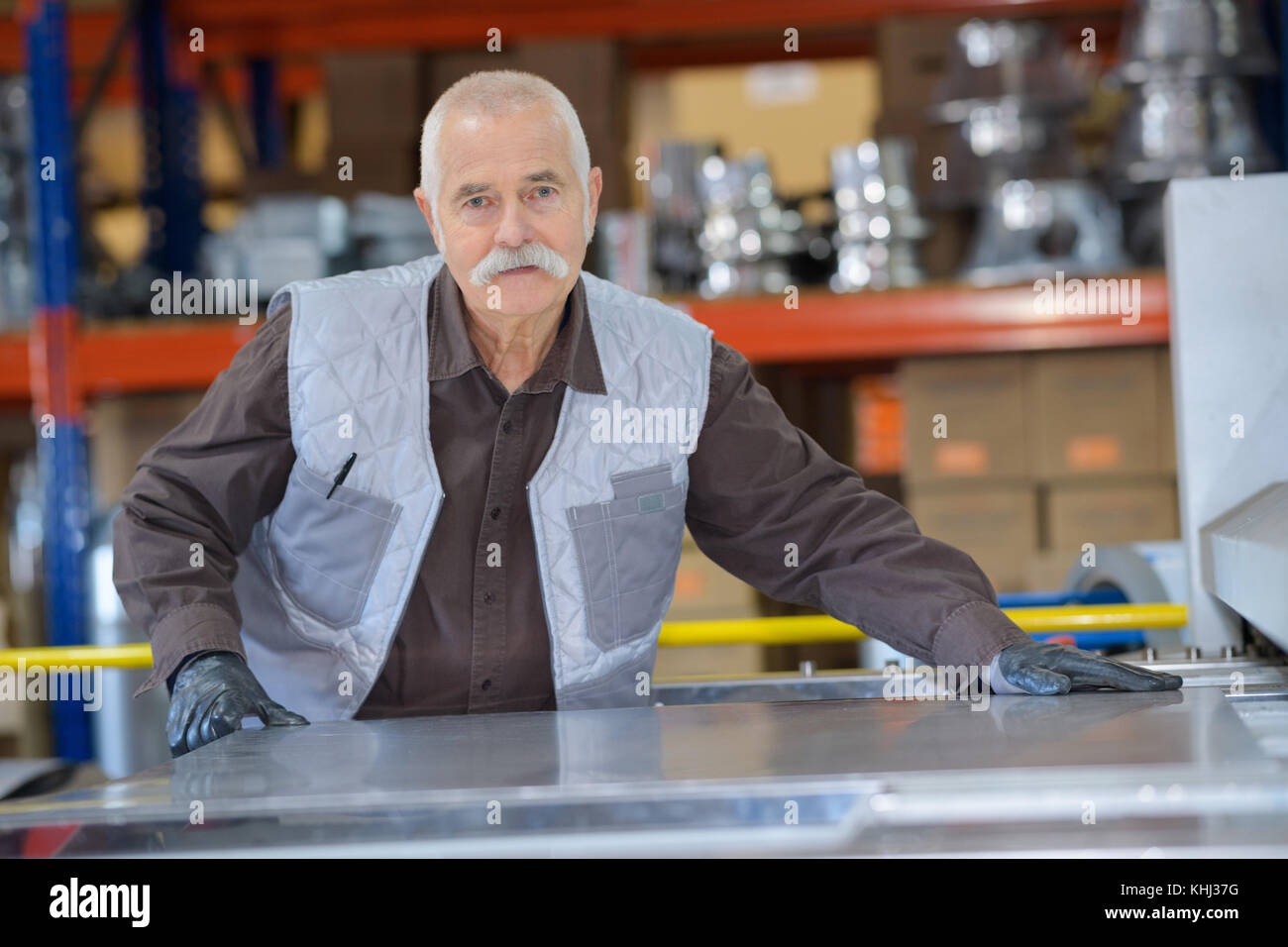 senior worker in metal factory Stock Photo - Alamy