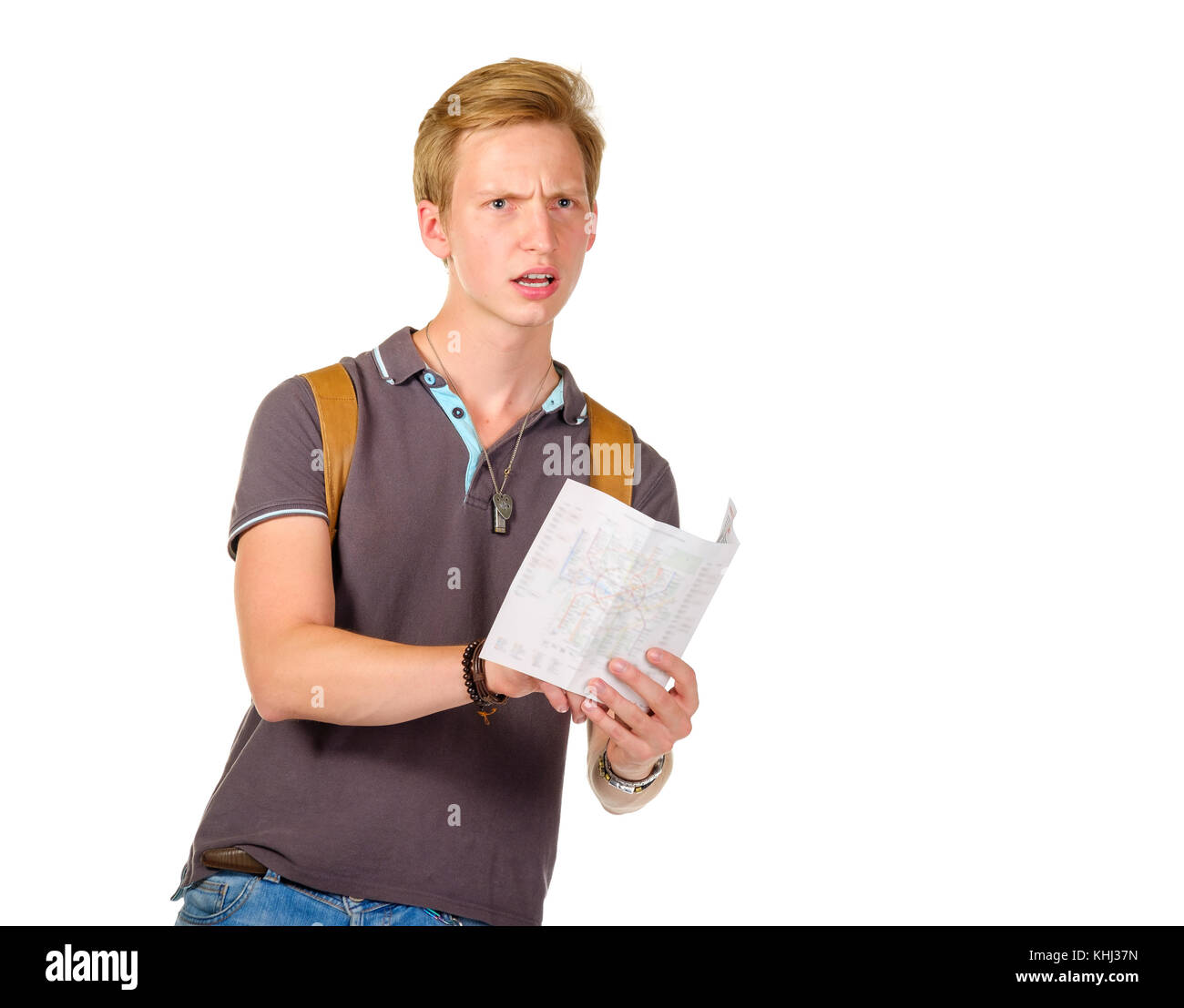 Young man traveler looking for a destination with map Stock Photo - Alamy