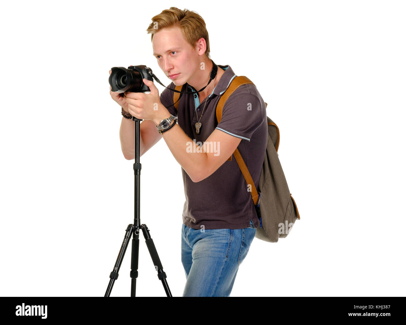Young man traveler taking pictures by dslr camera isolated Stock Photo ...