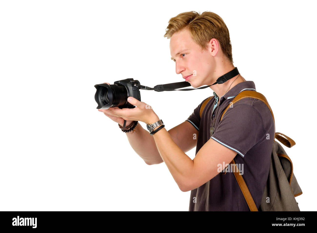 Young man traveler taking pictures by dslr camera isolated Stock Photo ...