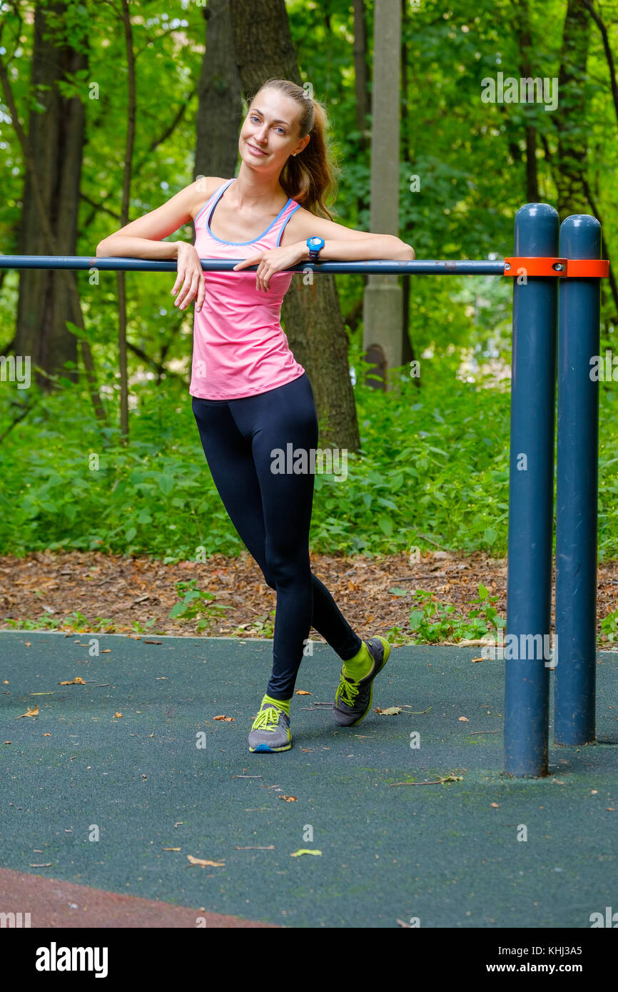 Young slim woman sports portrait on the training ground Stock Photo - Alamy