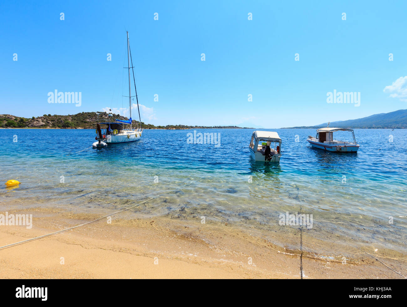 Three boats near shore. Summer sea coast landscape (Livari beach ...