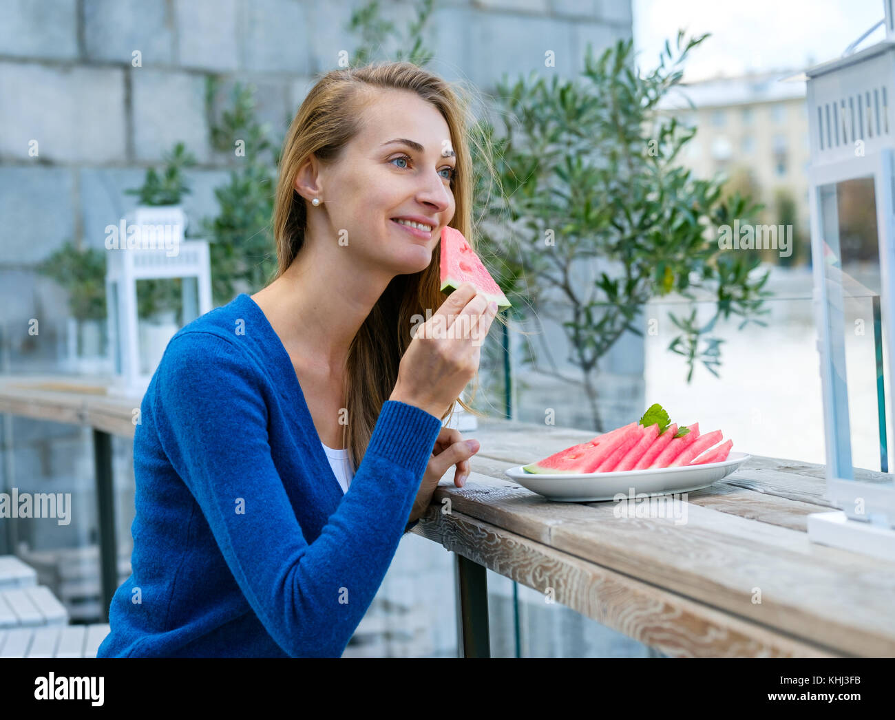 Young woman eating watermelon Stock Photo - Alamy