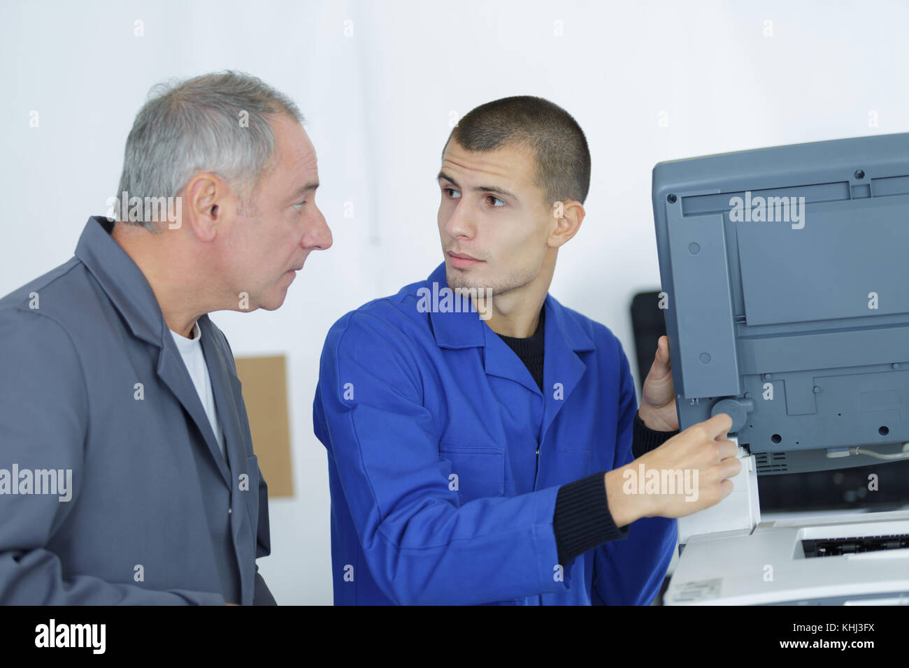 young apprentice with professional Stock Photo - Alamy
