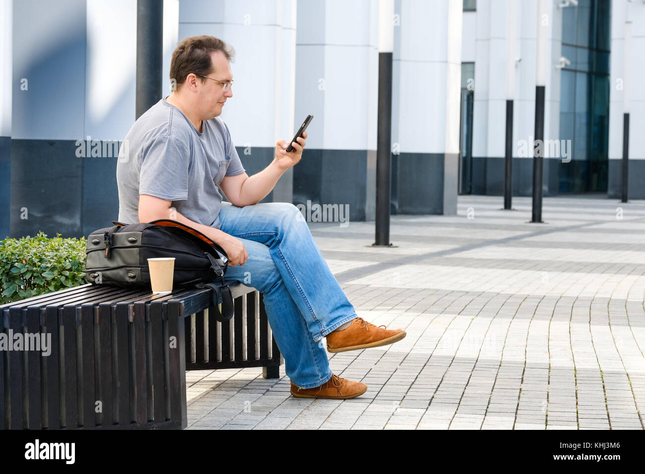 Middle age man reading tablet Stock Photo - Alamy