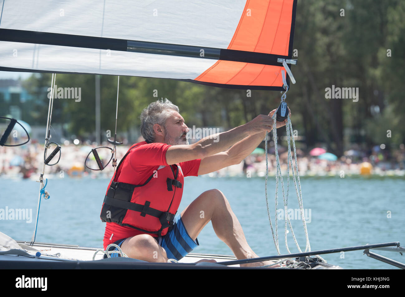 professional waterman training on lake with catamaran Stock Photo - Alamy