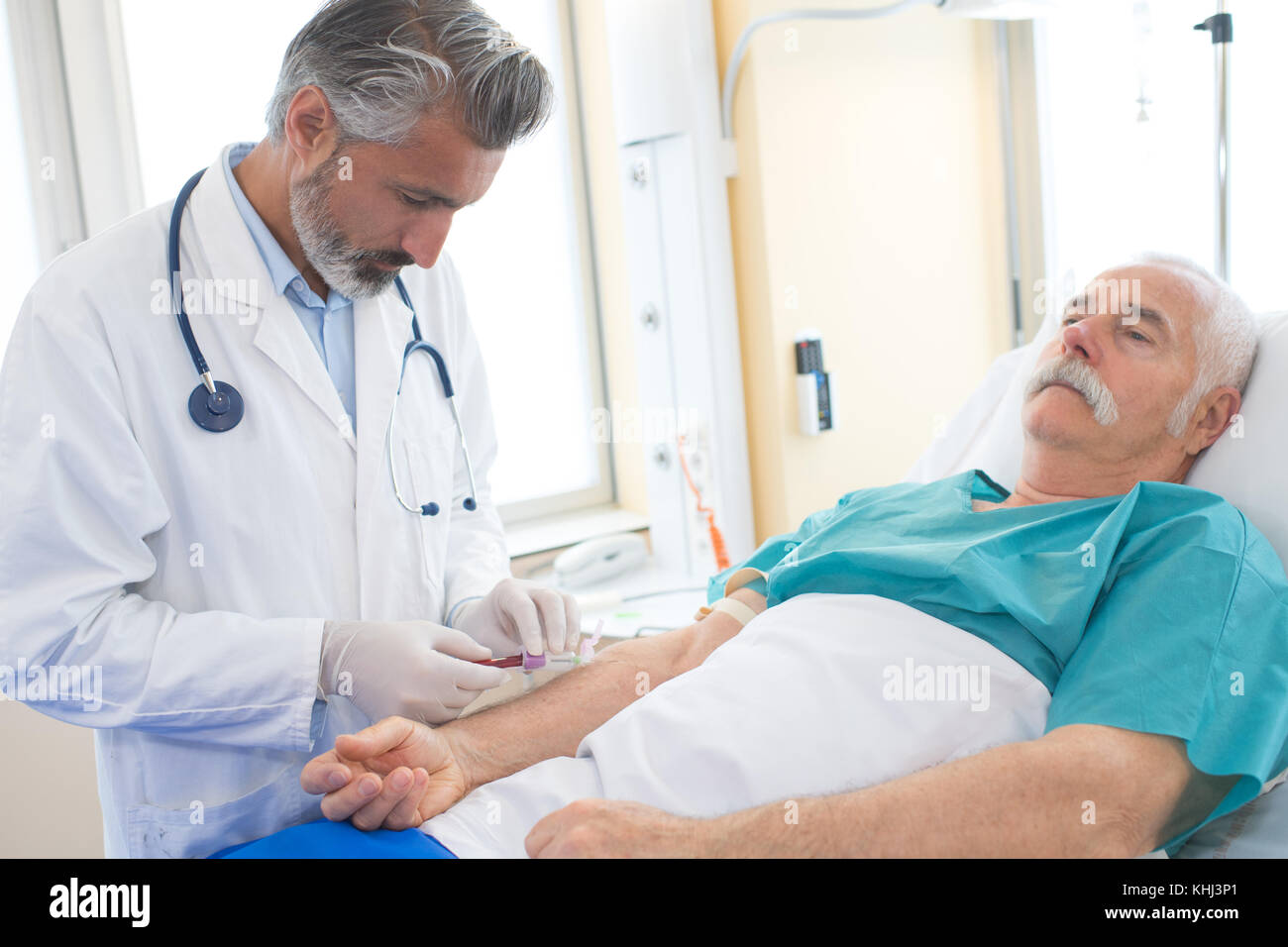 doctor is doing blood test for man in clinic Stock Photo - Alamy