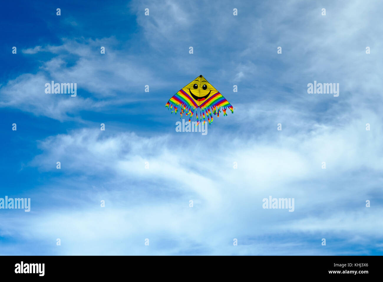 Flying kite in the blue sky Stock Photo - Alamy