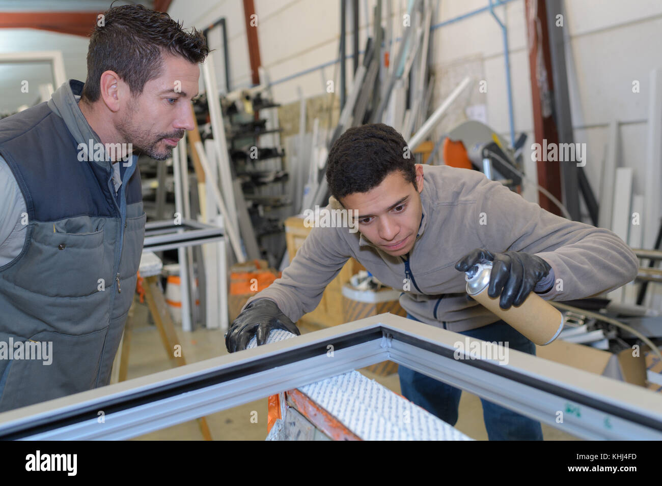 apprentice glazier and mentor in factory workshop Stock Photo - Alamy