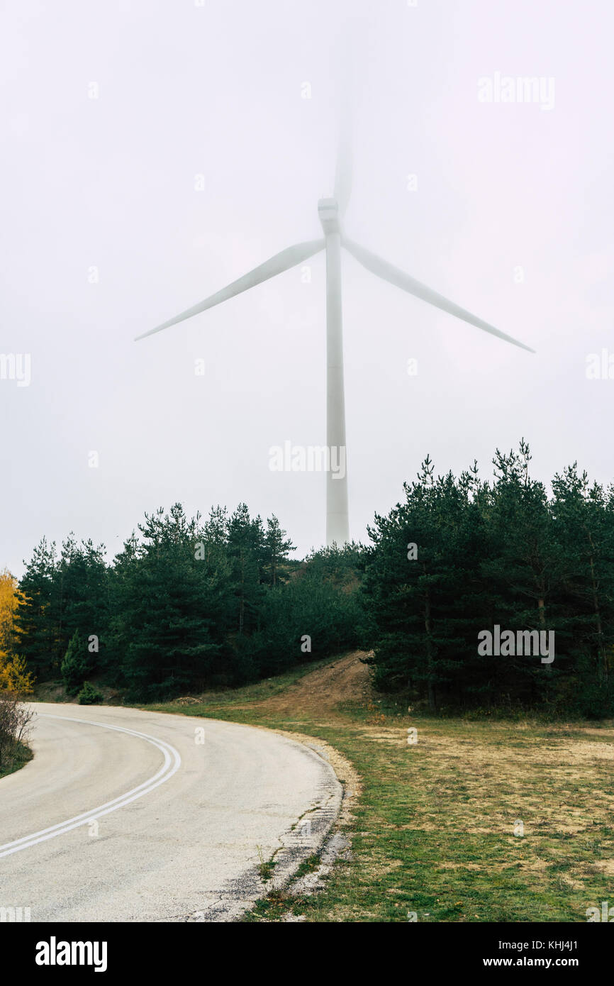 Wind power generator in fog Stock Photo - Alamy