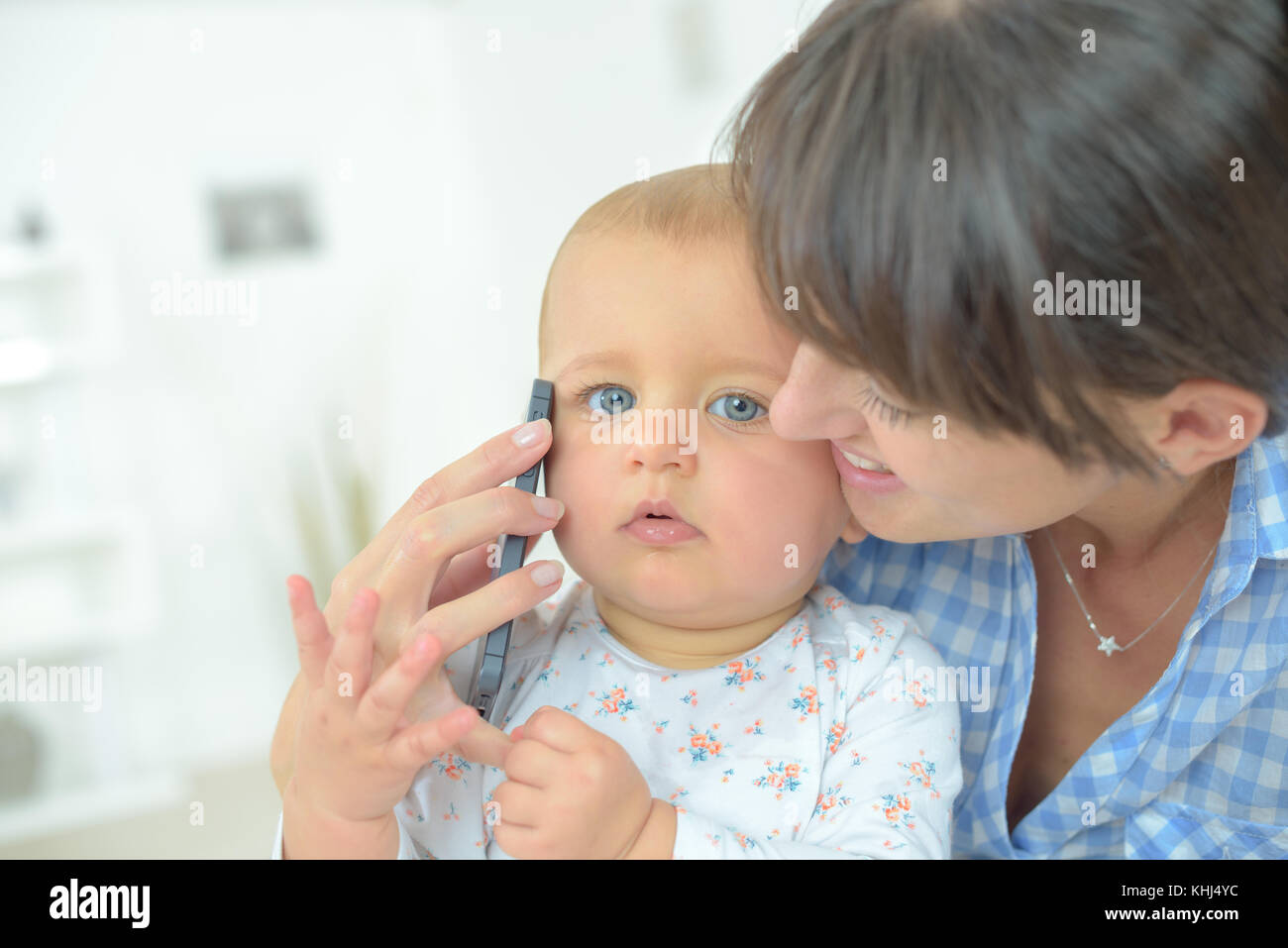 baby on the cellular phone Stock Photo - Alamy