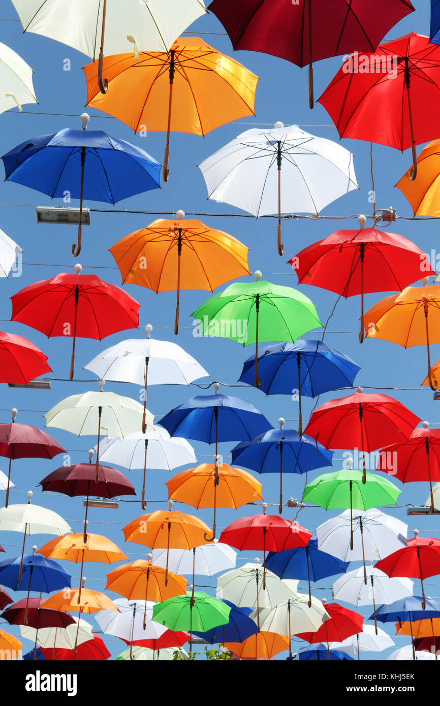 Rows of color umbrellas on the blue sky Stock Photo - Alamy