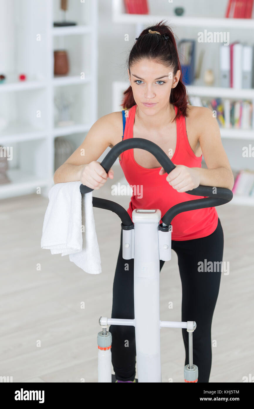 young attractive girl exercise on step machine Stock Photo - Alamy