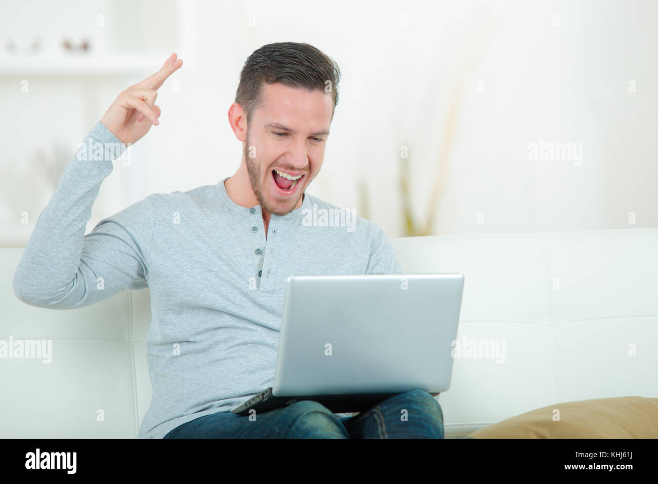 excited entrepreneur working with a laptop Stock Photo - Alamy