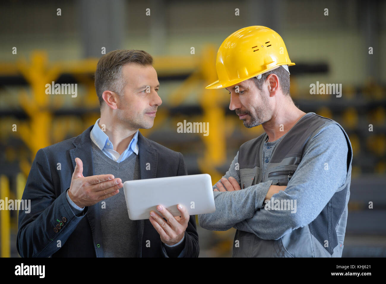 metallurgy workers in workshop using digital tablet Stock Photo - Alamy