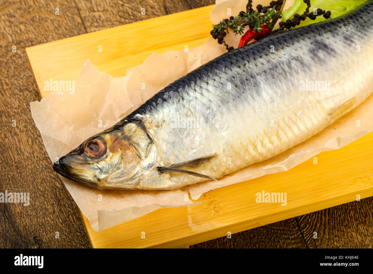 Salted Herring fish with pepper and spices Stock Photo - Alamy
