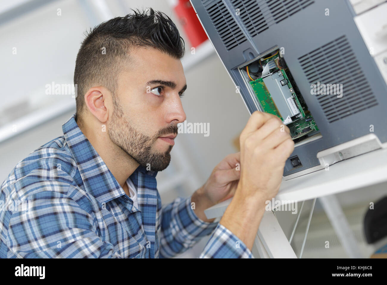 electrician works with machine electronic Stock Photo - Alamy