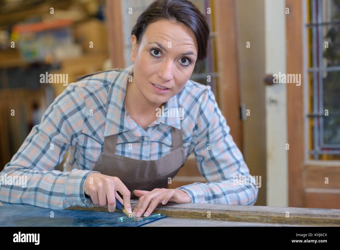 Female artist working with glass Stock Photo - Alamy