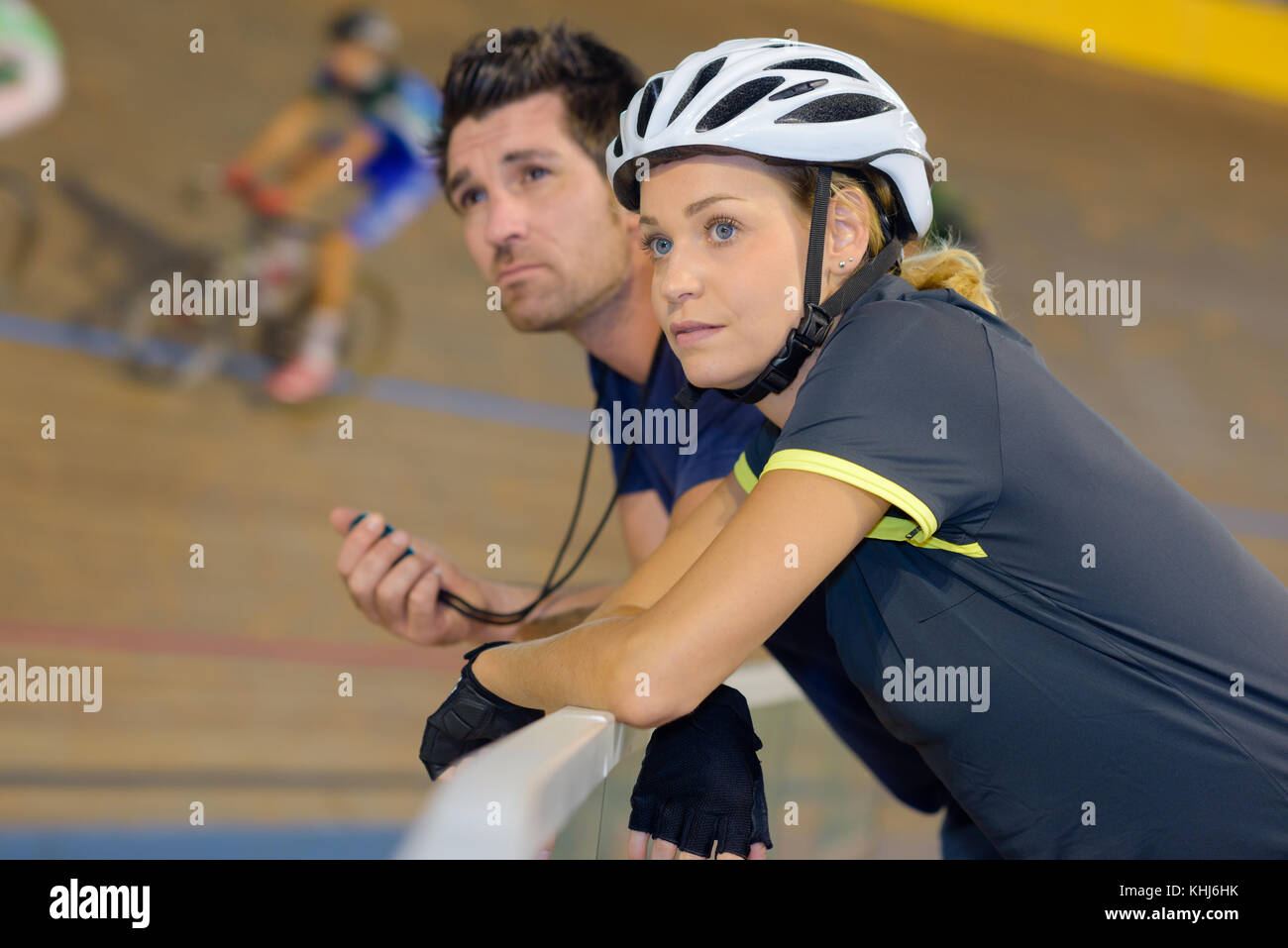 cyclist resting beside a coach Stock Photo - Alamy
