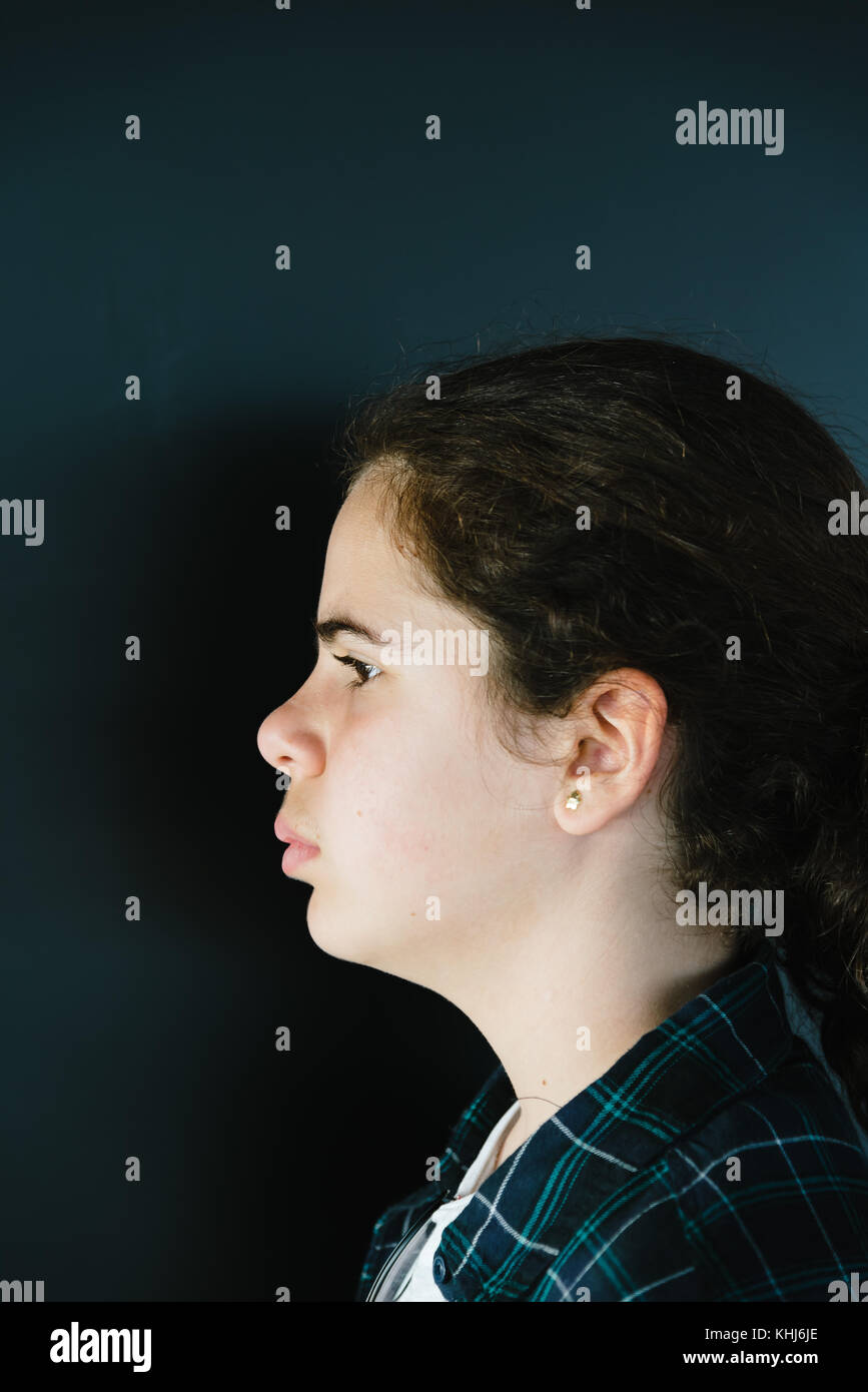 Headshot portrait of serious teenager. Side view Stock Photo - Alamy