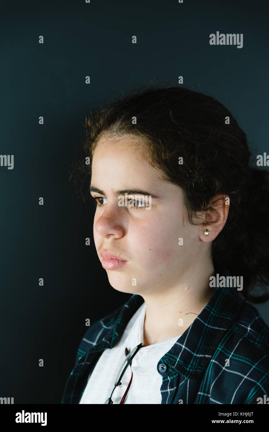 Headshot portrait of serious teenager. Side view Stock Photo - Alamy