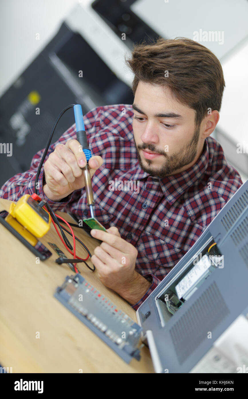 computer engineer working on broken console Stock Photo - Alamy